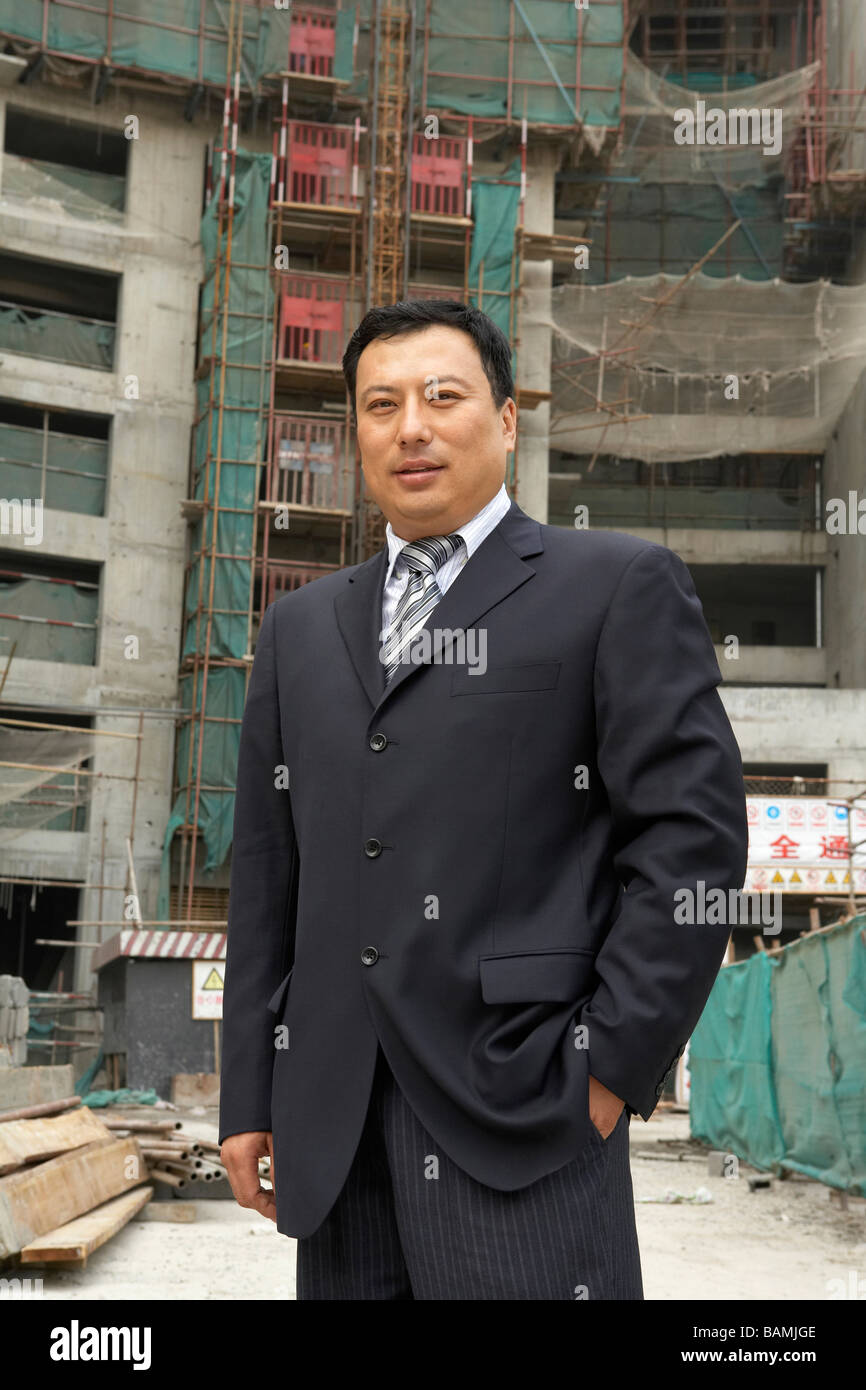 Construction Contractor Standing On Building Site Stock Photo - Alamy