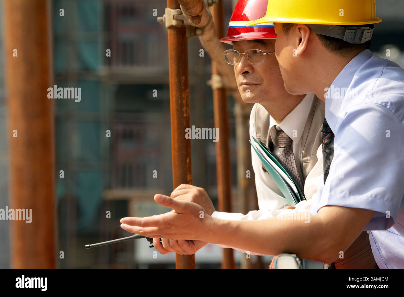 Construction Contractors Talking To Each Other Stock Photo - Alamy