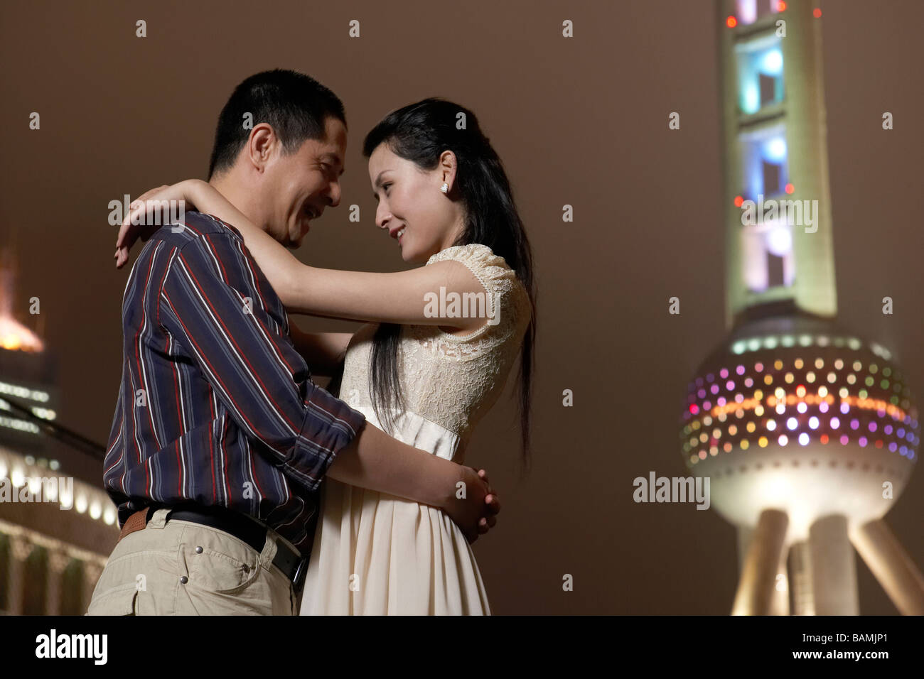 Couple With Arms Around Each Other Stock Photo - Alamy