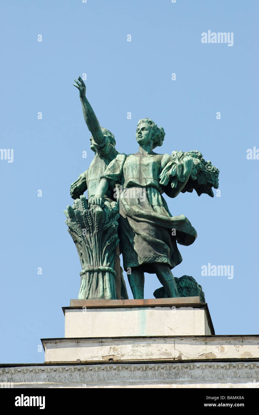 Bronze statues of collective farmers above the central pavilion on VVTs ...