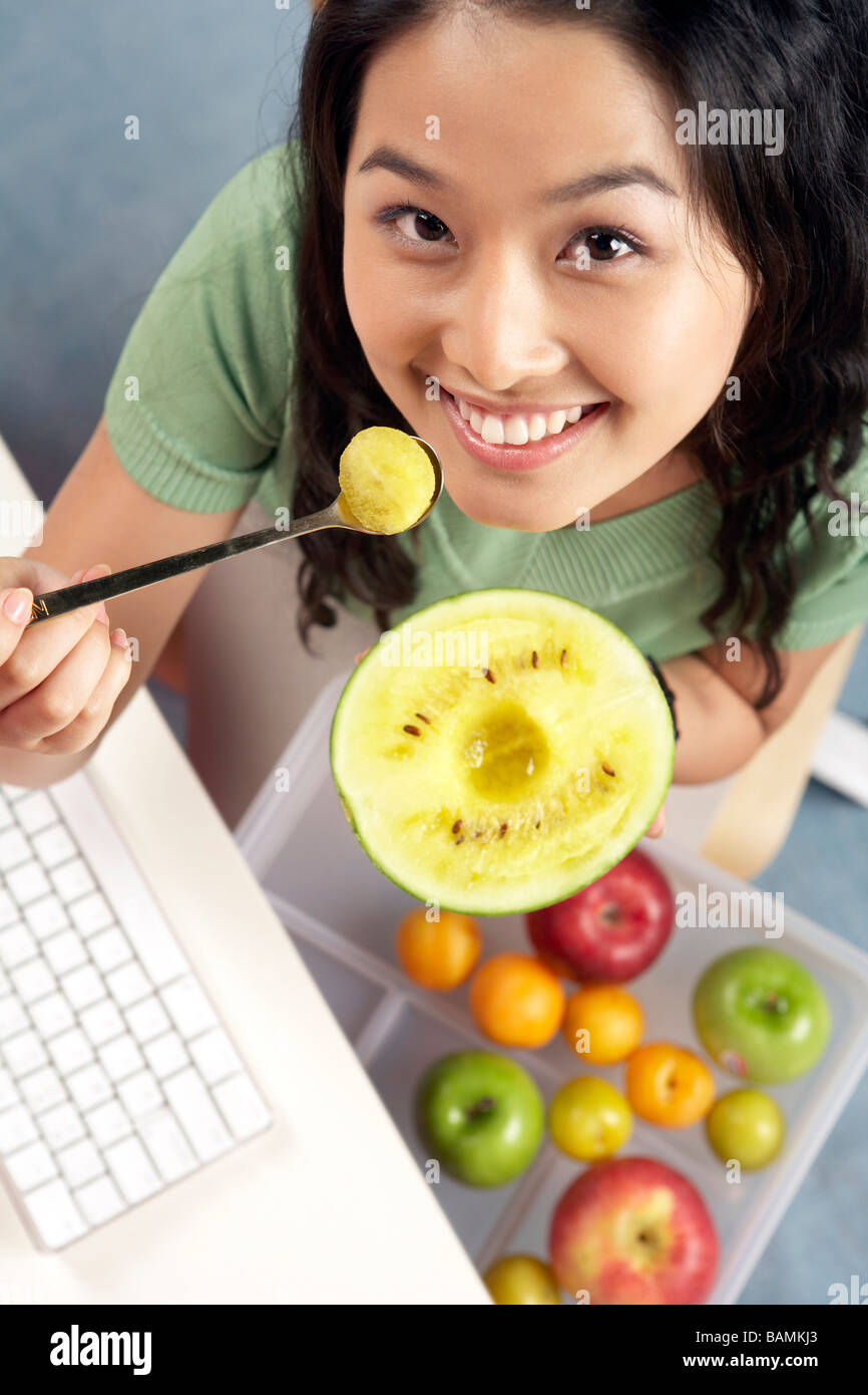 Woman Eating Fruit Stock Photo - Alamy