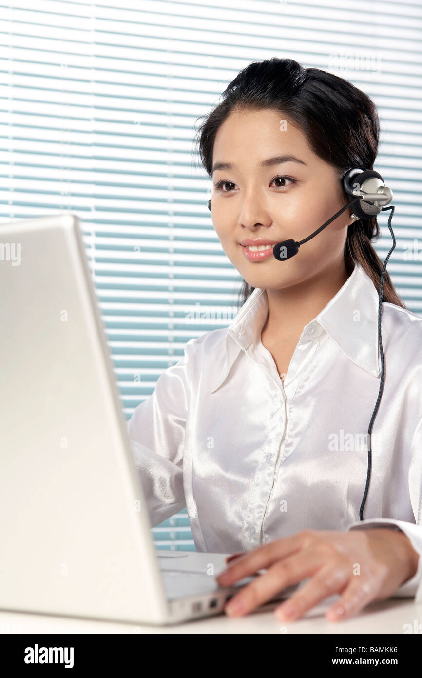 Woman Wearing A Headset Stock Photo - Alamy