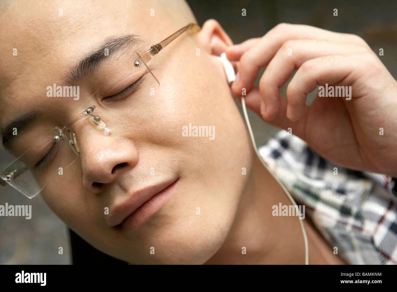 Man Listening To Mp3 Player With Eyes Closed Stock Photo - Alamy