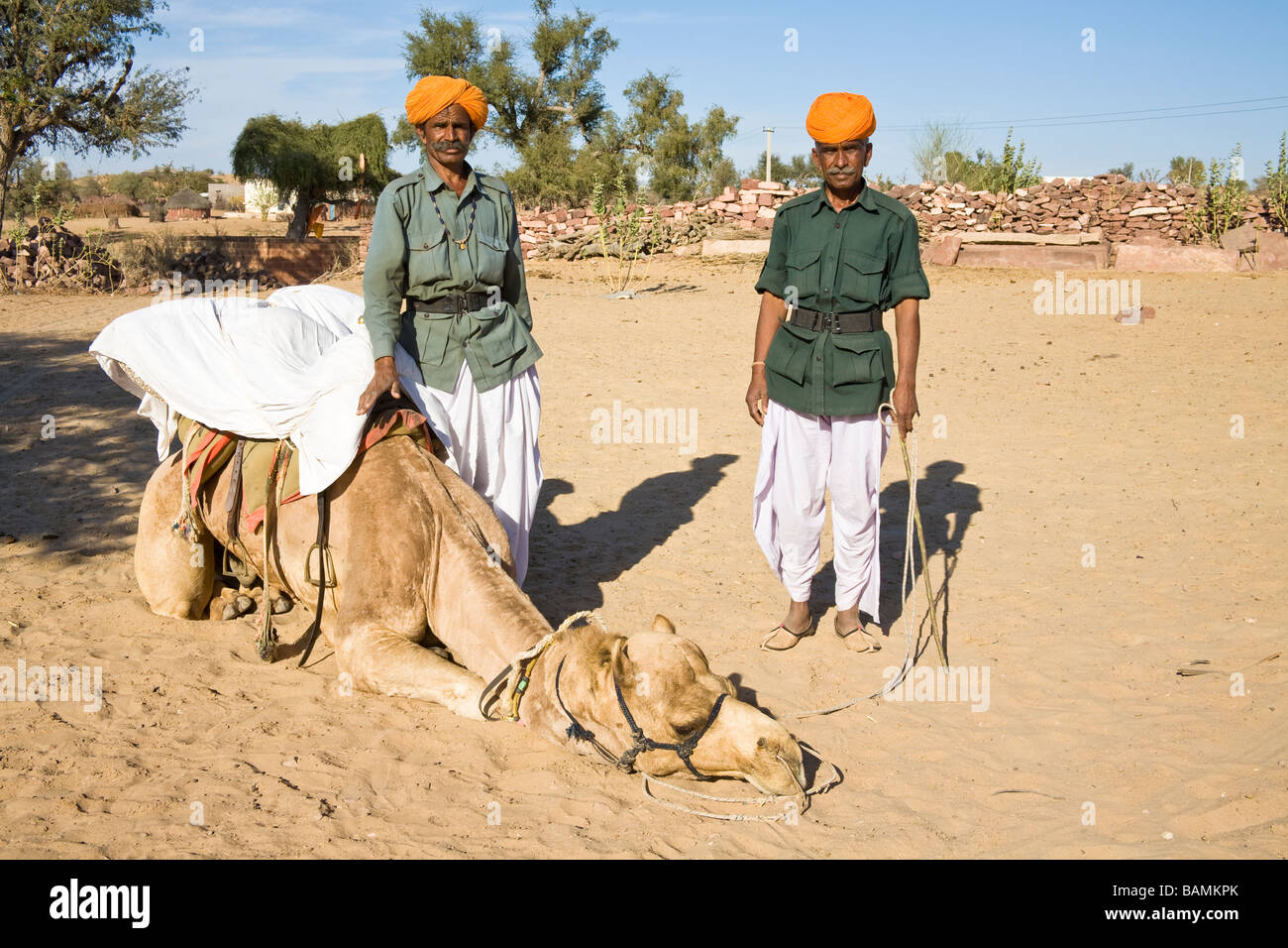 Camel drivers from Osian Camel Camp standing beside a camel, Osian ...