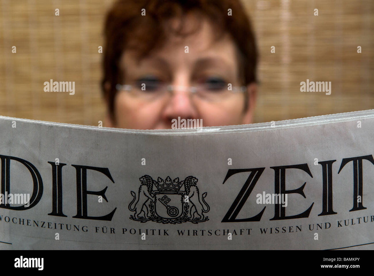 German woman reading 'Die Zeit' the national broadsheet newspaper ...