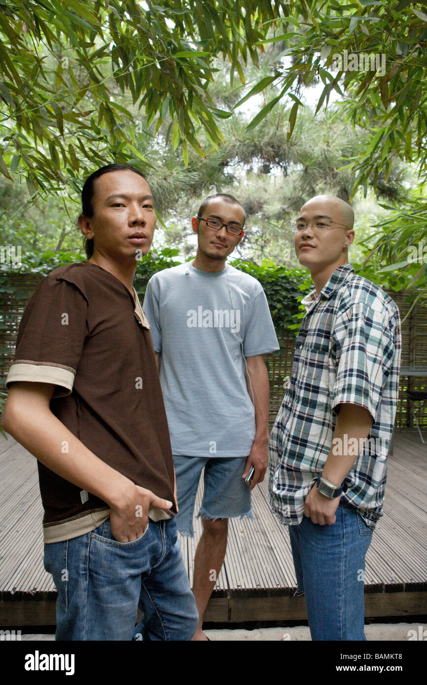 Three Young Men Outdoors Looking At Camera Stock Photo - Alamy