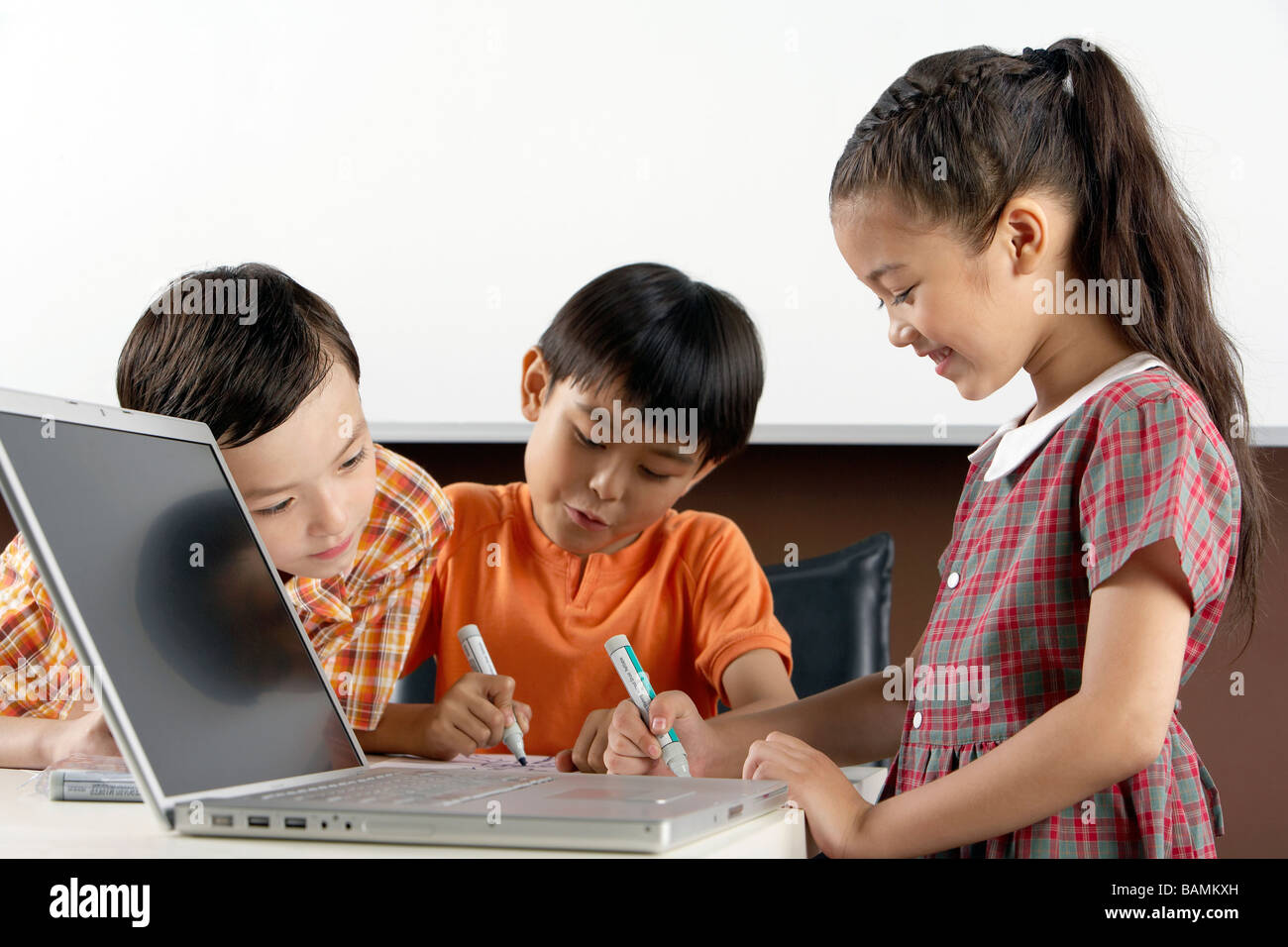 Children Colouring Together Stock Photo - Alamy