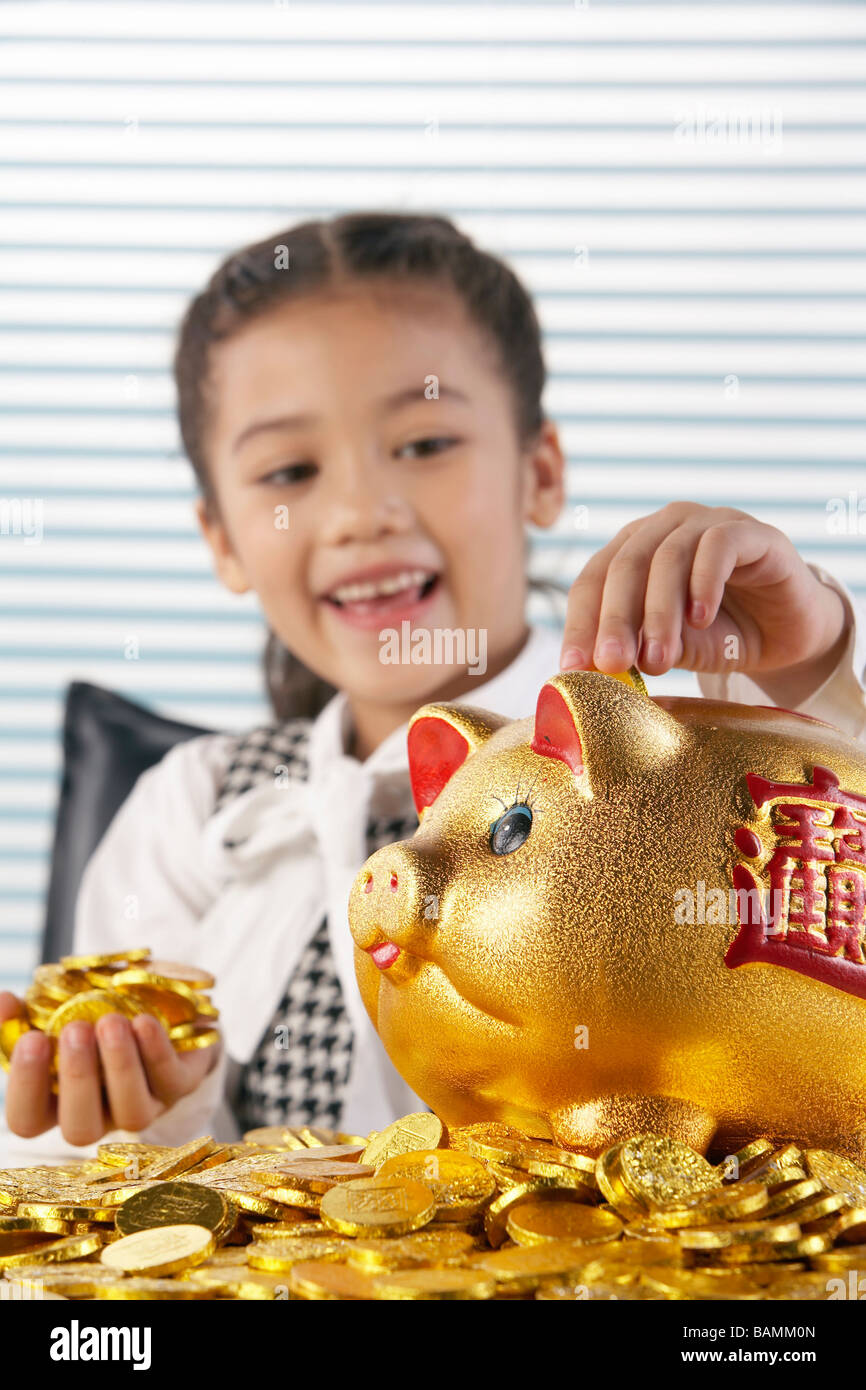 Young Girl With Gold Coins Smiling Happily Stock Photo - Alamy