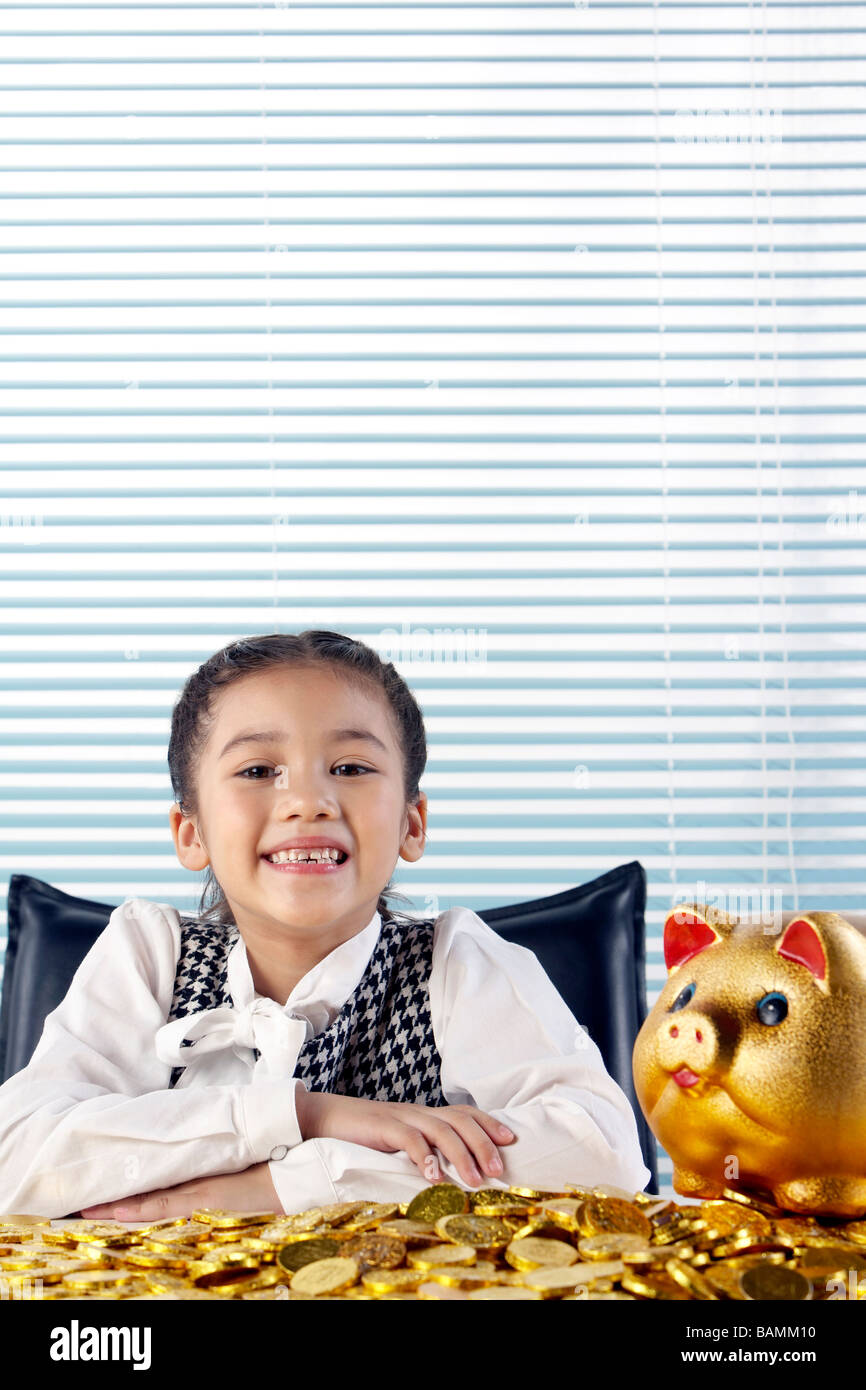 Young Girl With Gold Coins Smiling Happily Stock Photo - Alamy