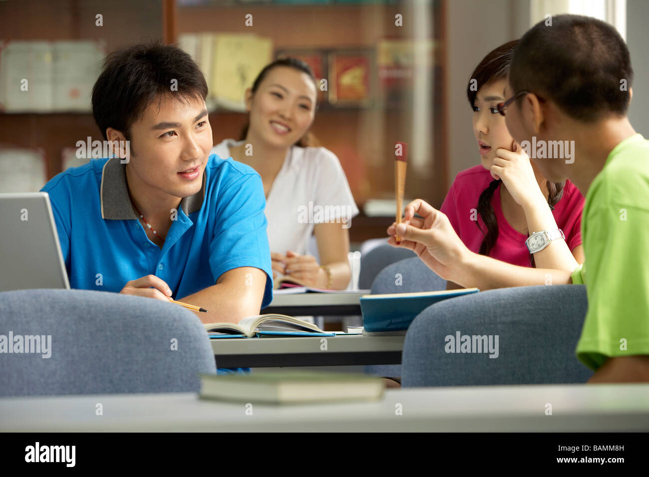 Students Talking In A Classroom Stock Photo - Alamy