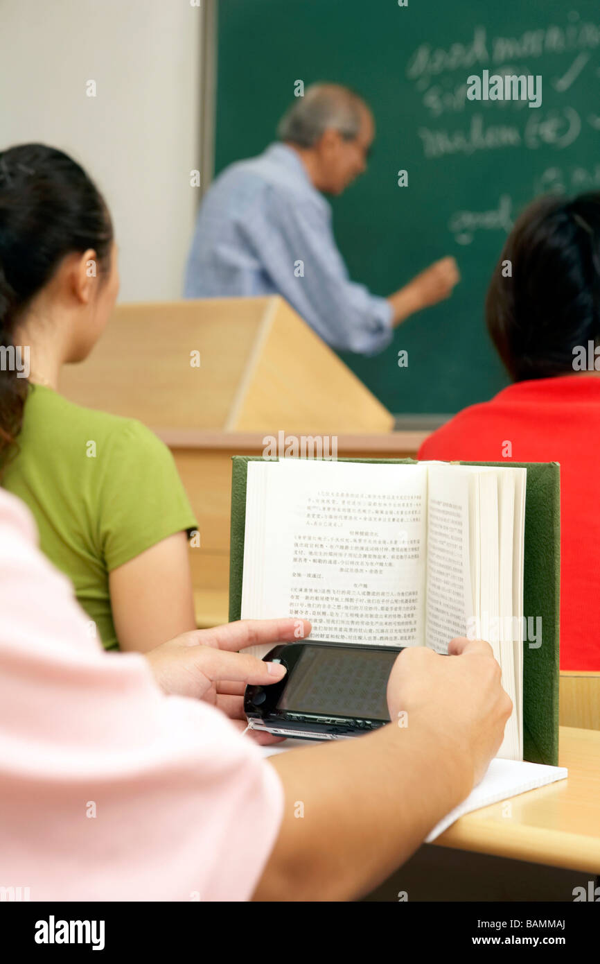 Student Playing A Video Game In The Classroom Stock Photo - Alamy