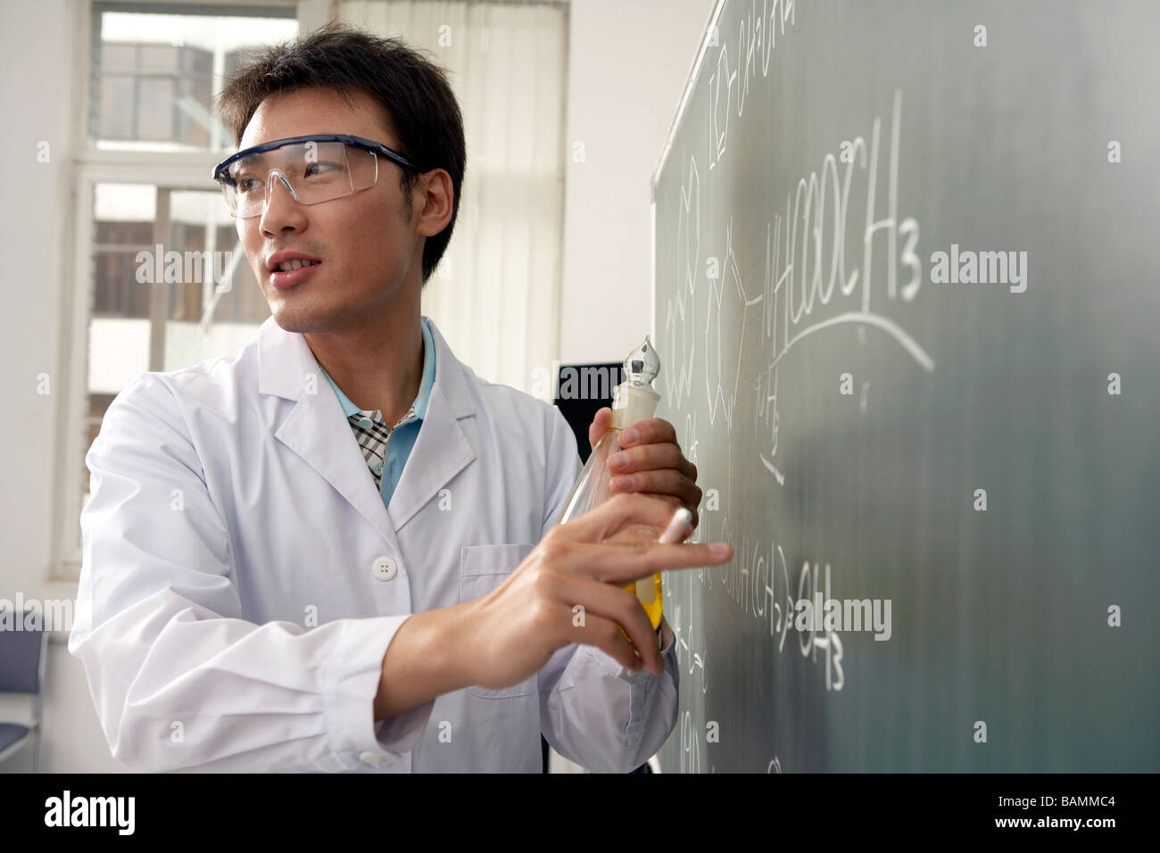 Young scientist explaining human hi-res stock photography and images ...