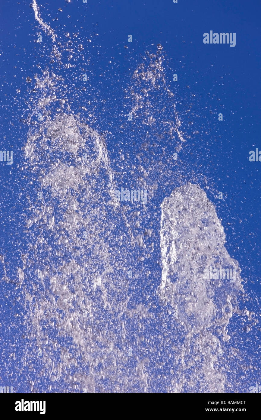 Water spouting into air against blue sky Stock Photo - Alamy