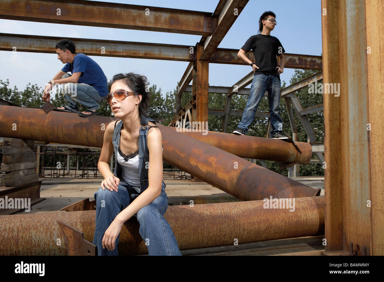 Young People Standing On Pipes Stock Photo - Alamy