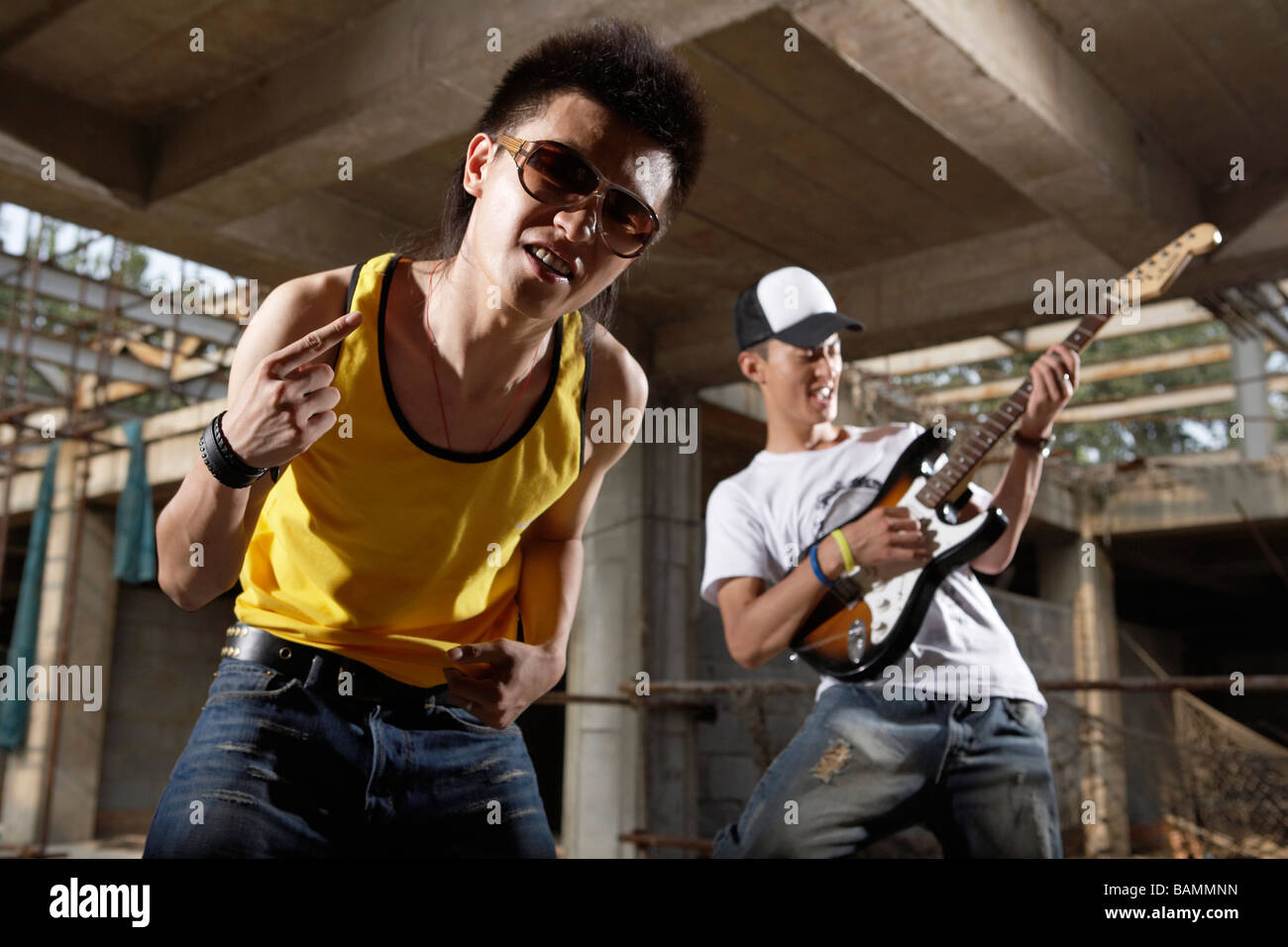 2 two men males playing instruments hi-res stock photography and images ...