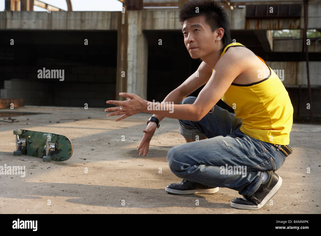 Man Crouching Down Stock Photo - Alamy
