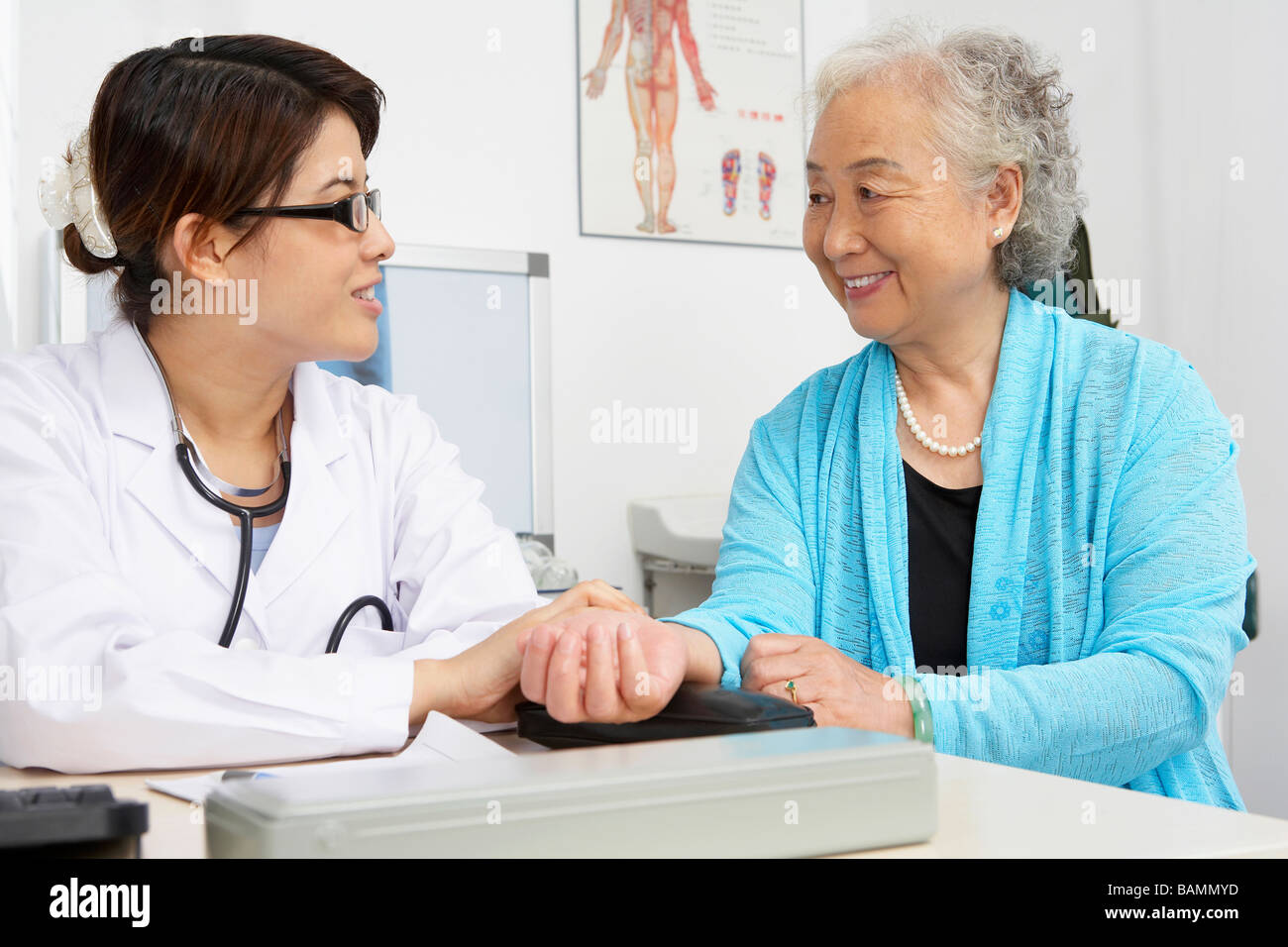 Doctor Checking Patient's Pulse Stock Photo - Alamy