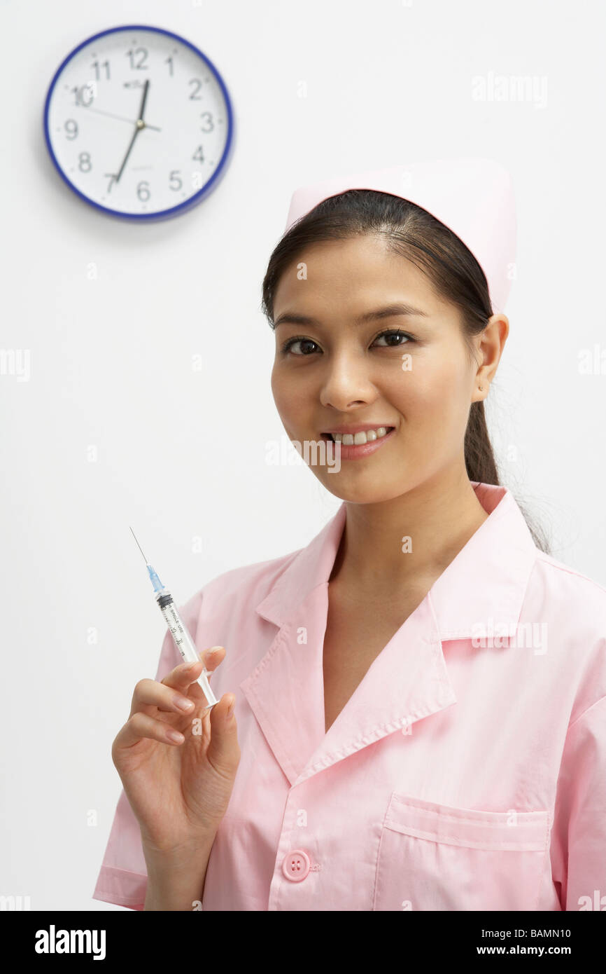 Nurse Holding Syringe Stock Photo - Alamy