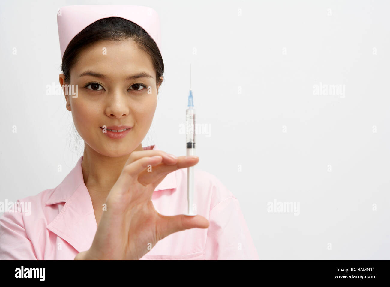 Nurse Holding Syringe Stock Photo - Alamy