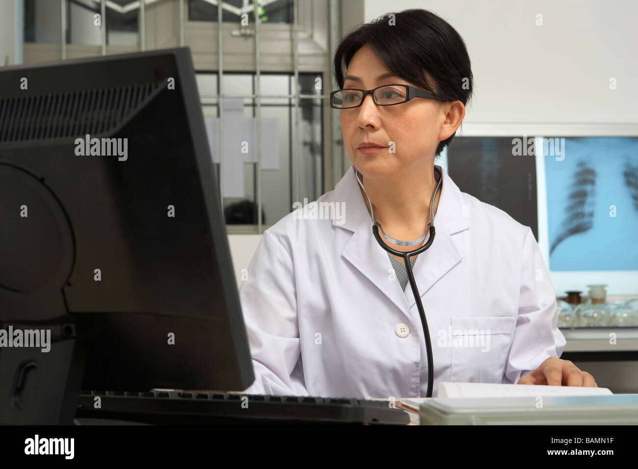 Doctor Typing On Computer Stock Photo - Alamy