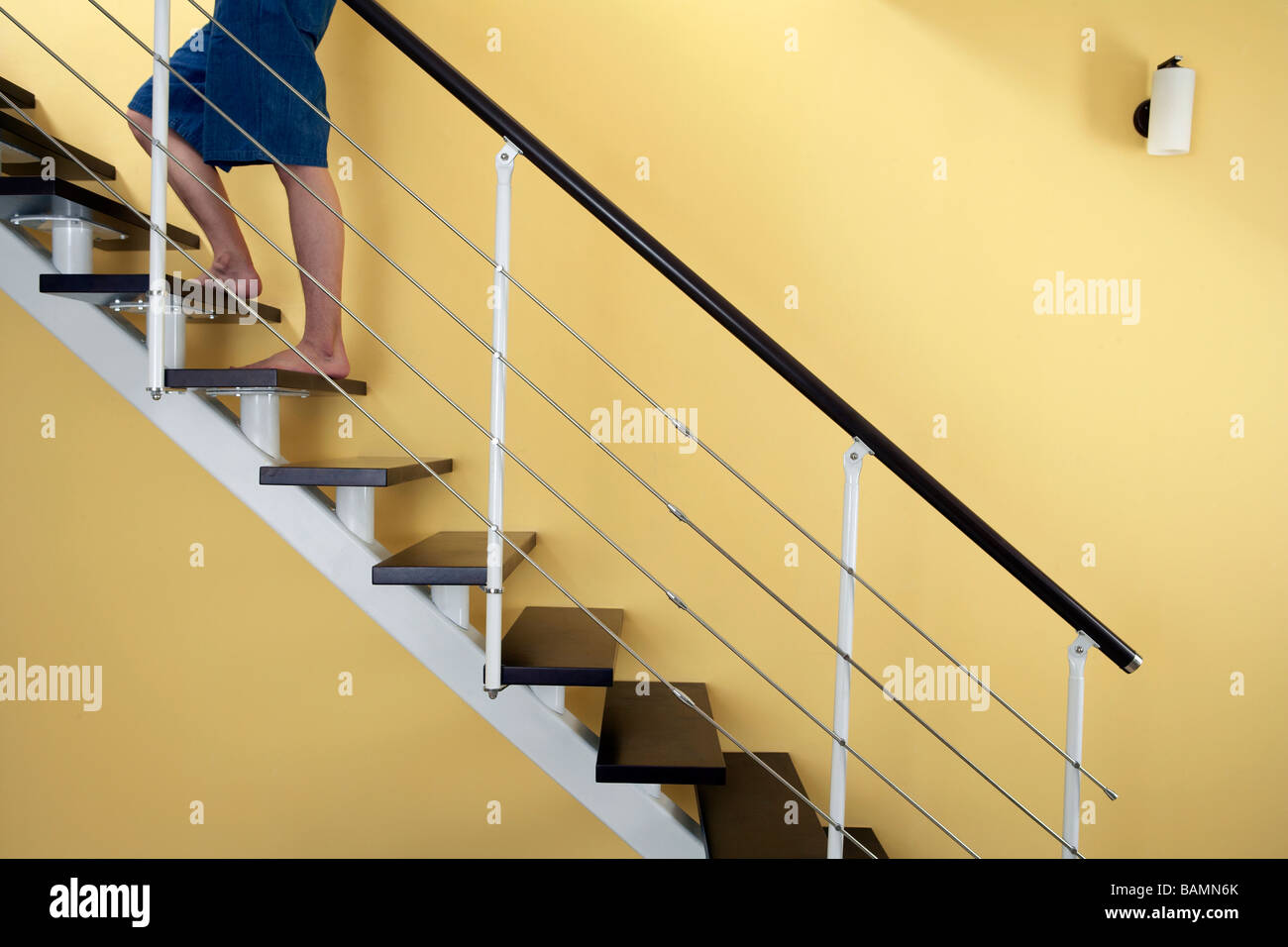 Man Walking Up Staircase Stock Photo - Alamy