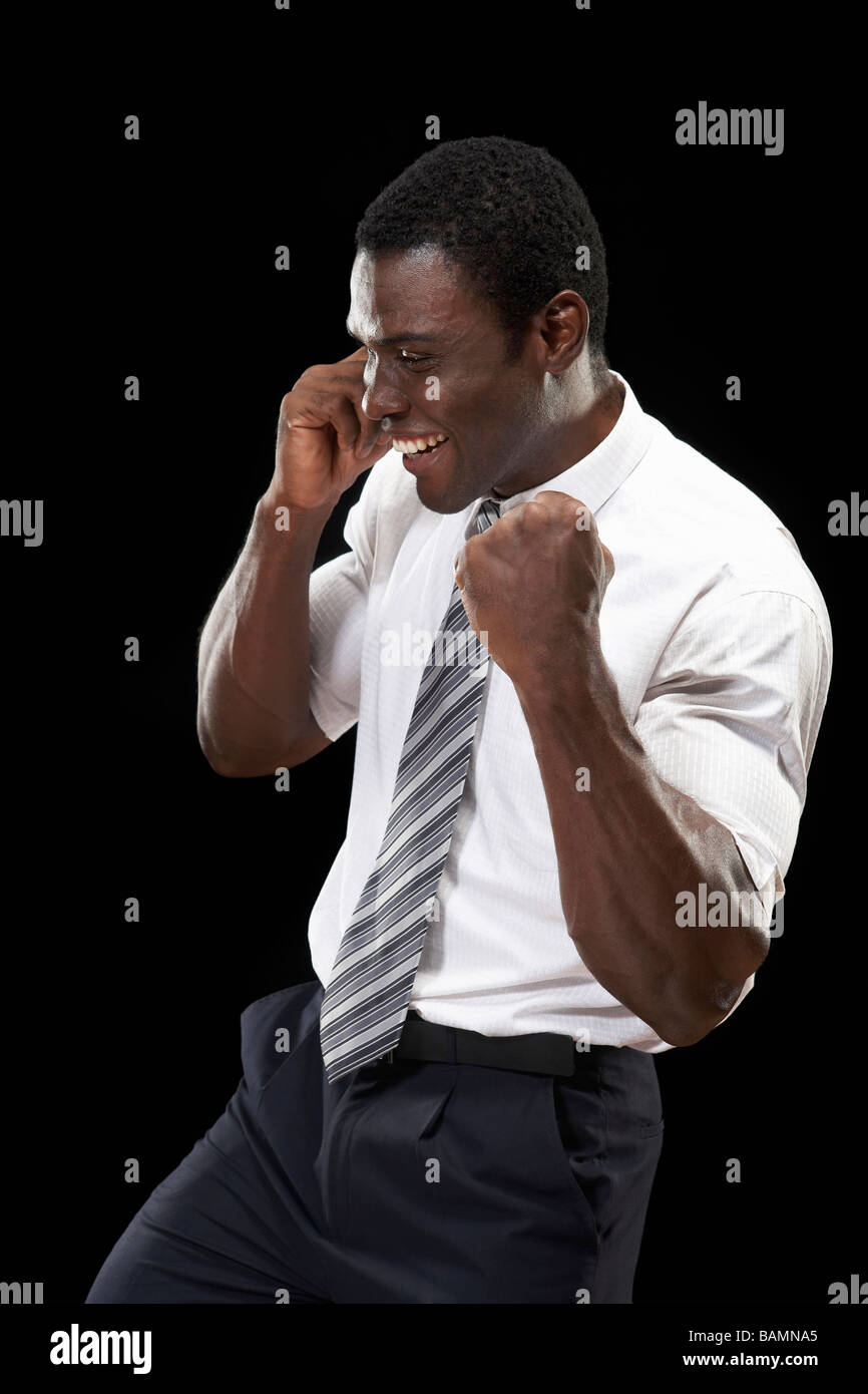 Businessman Talking On Cellphone And Punching The Air Stock Photo - Alamy