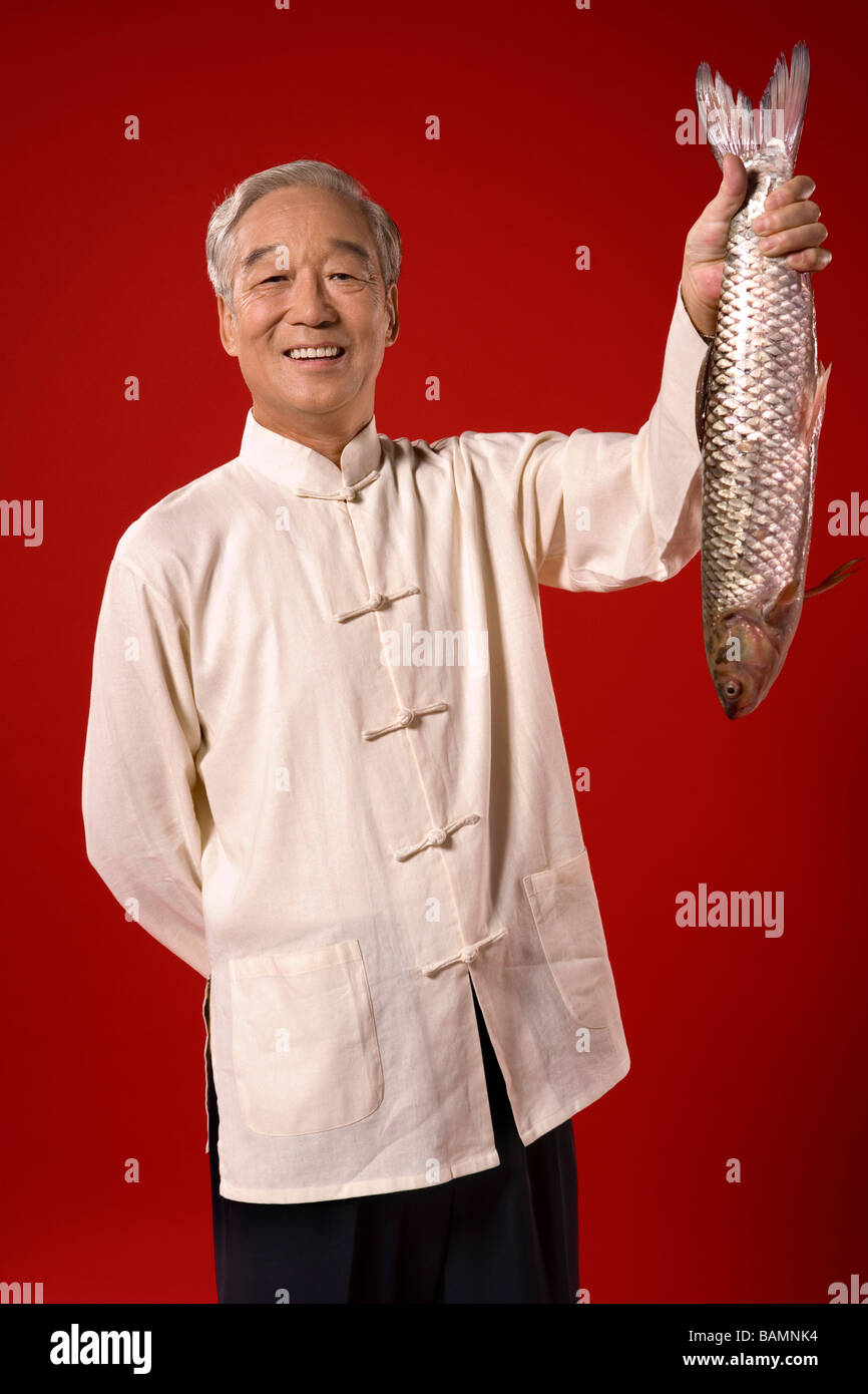 Old man showing off his fish hi-res stock photography and images - Alamy