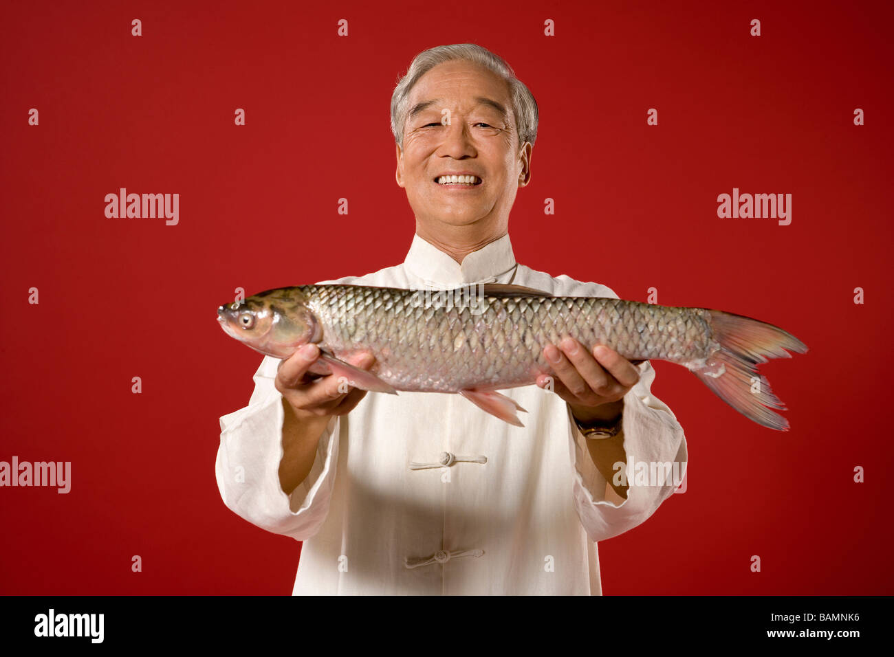 Old man showing off his fish hi-res stock photography and images - Alamy