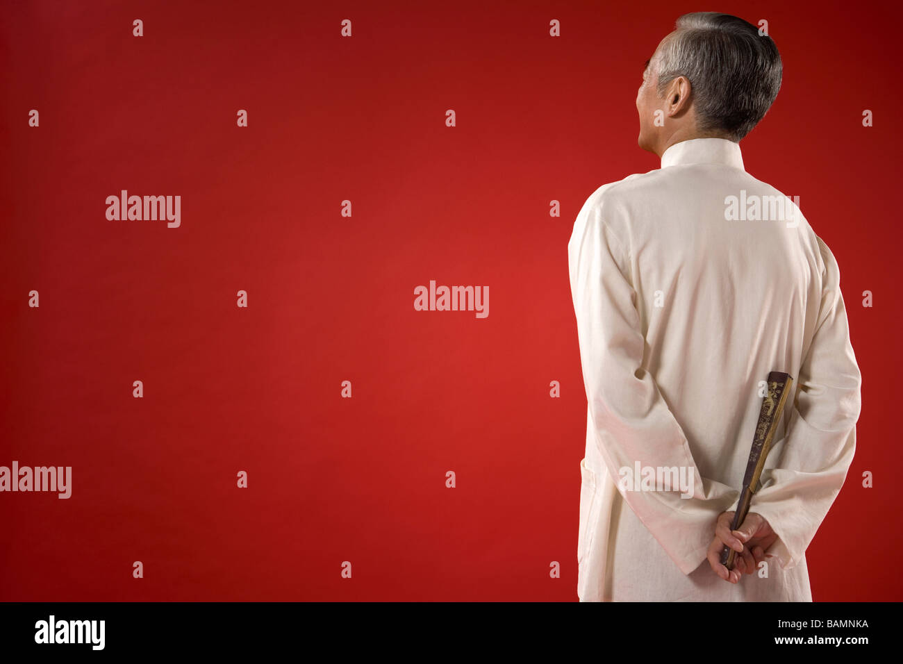 Elderly Man With Fan Staring Into Distance Stock Photo - Alamy
