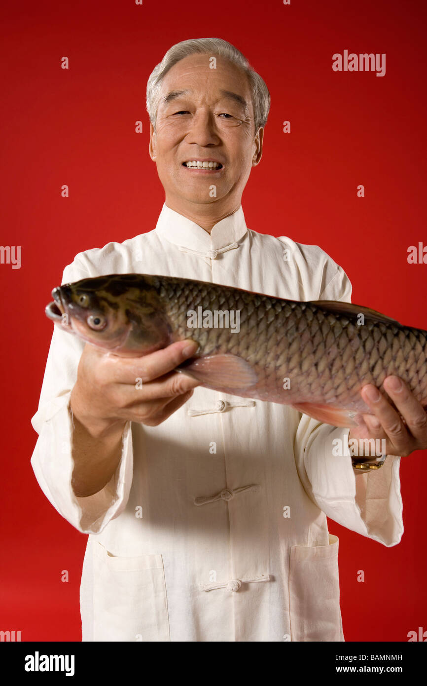 Old man showing off his fish hi-res stock photography and images - Alamy
