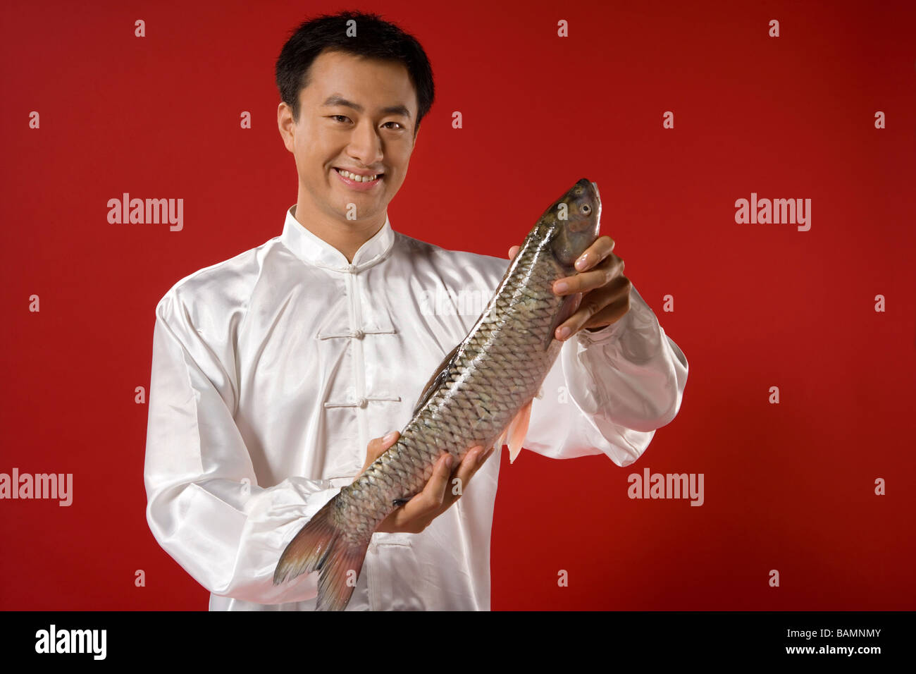 Man Showing Off Raw Fish Stock Photo - Alamy