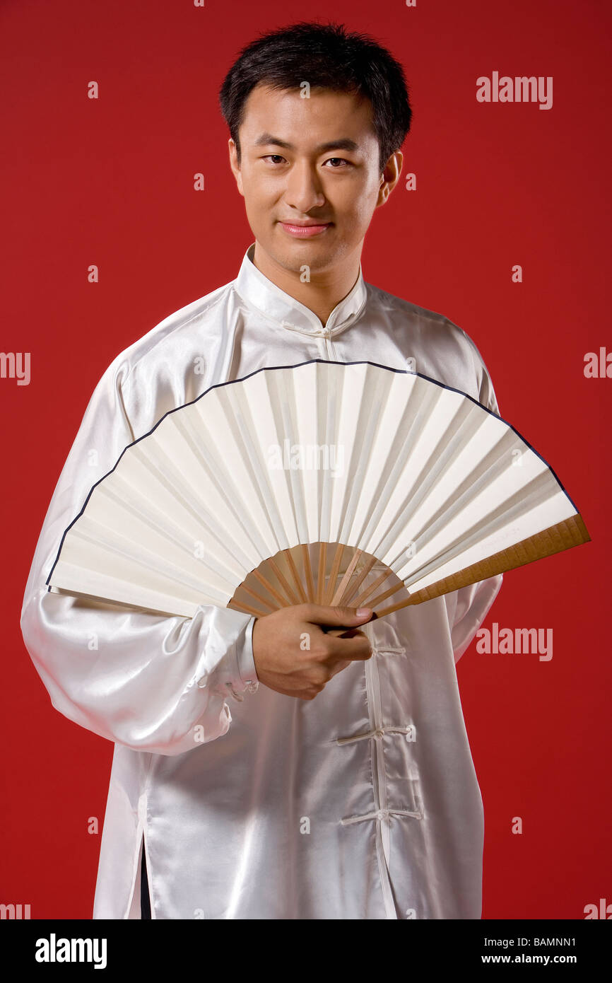 Man With Fan Looking At Camera Stock Photo - Alamy