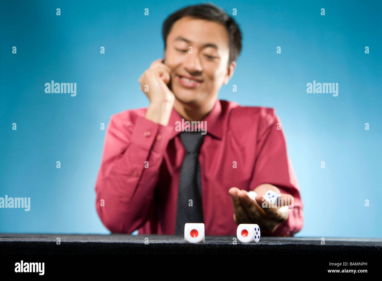 Businessman throwing dice hi-res stock photography and images - Alamy