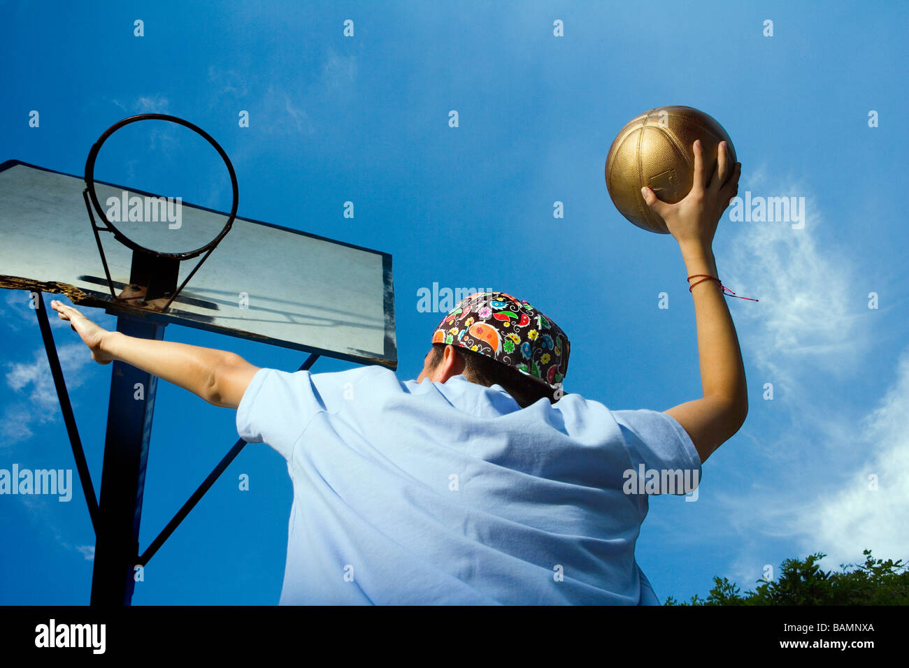 Teenage Boy Shooting Basketball At Hoop Stock Photo - Alamy