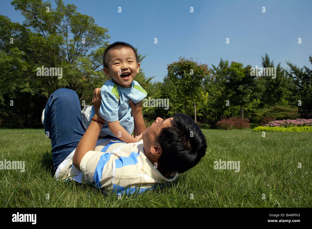 Father And Son In The Park Stock Photo - Alamy