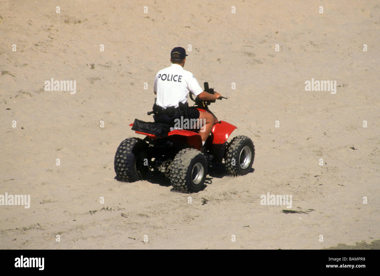 Beach patrol police officer lifeguard four wheel scooter ATV vehicle ...