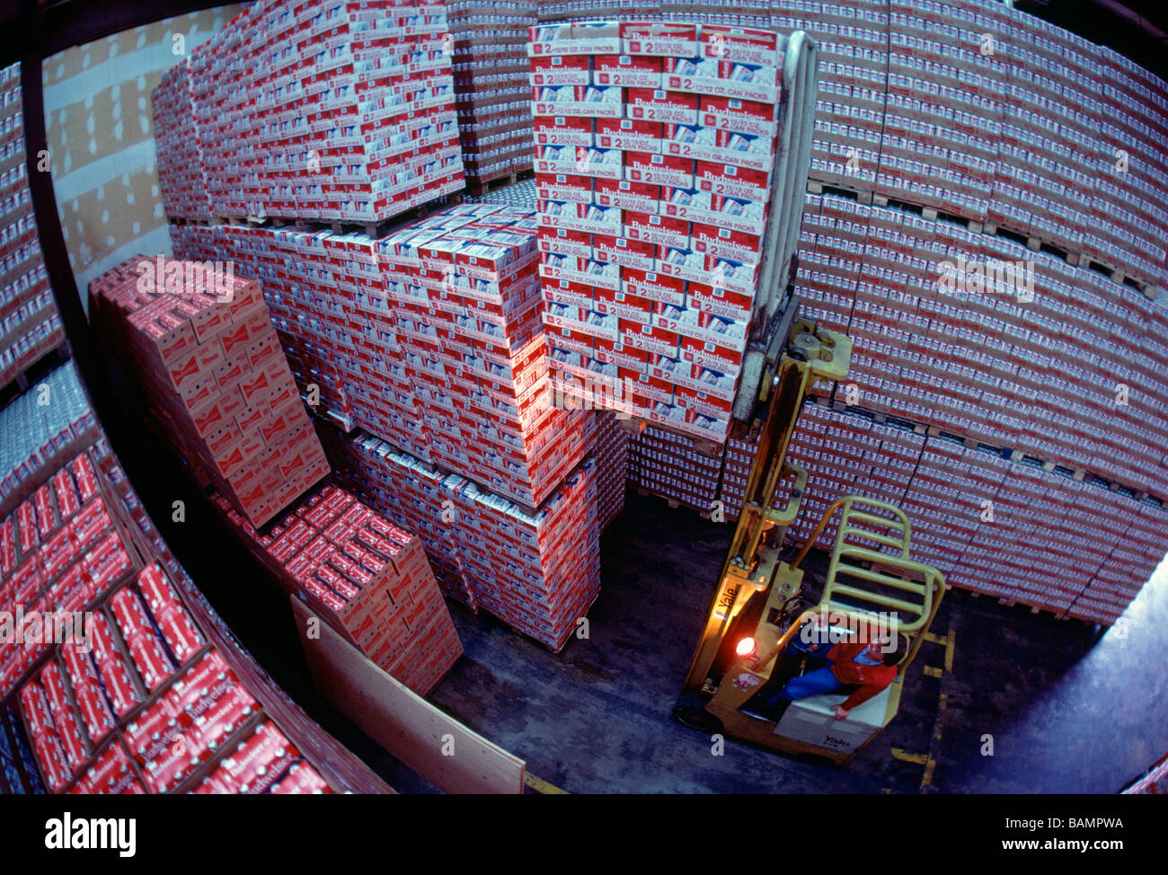 Forklift truck moving pallets of beer in a distribution warehouse Stock ...