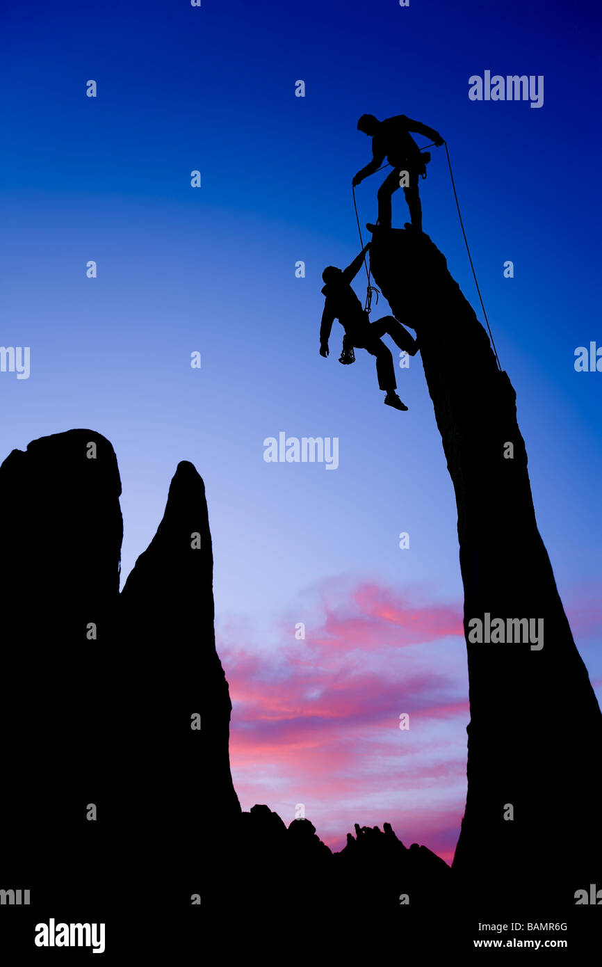 Climbers reaching a mountain top hi-res stock photography and images ...