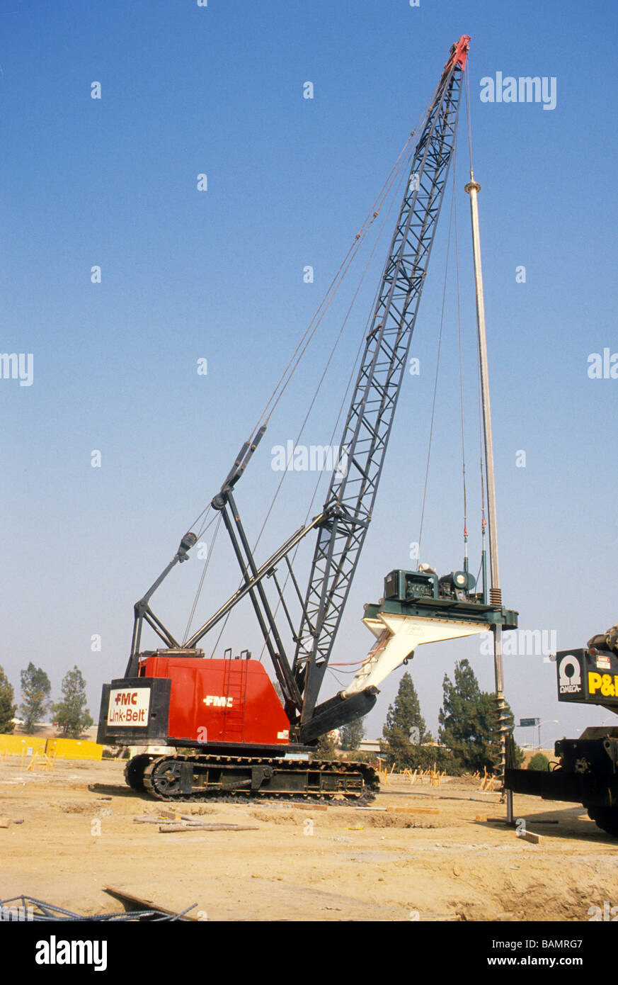 Large huge crane lift drill hole earth dirt dig construct build piling ...