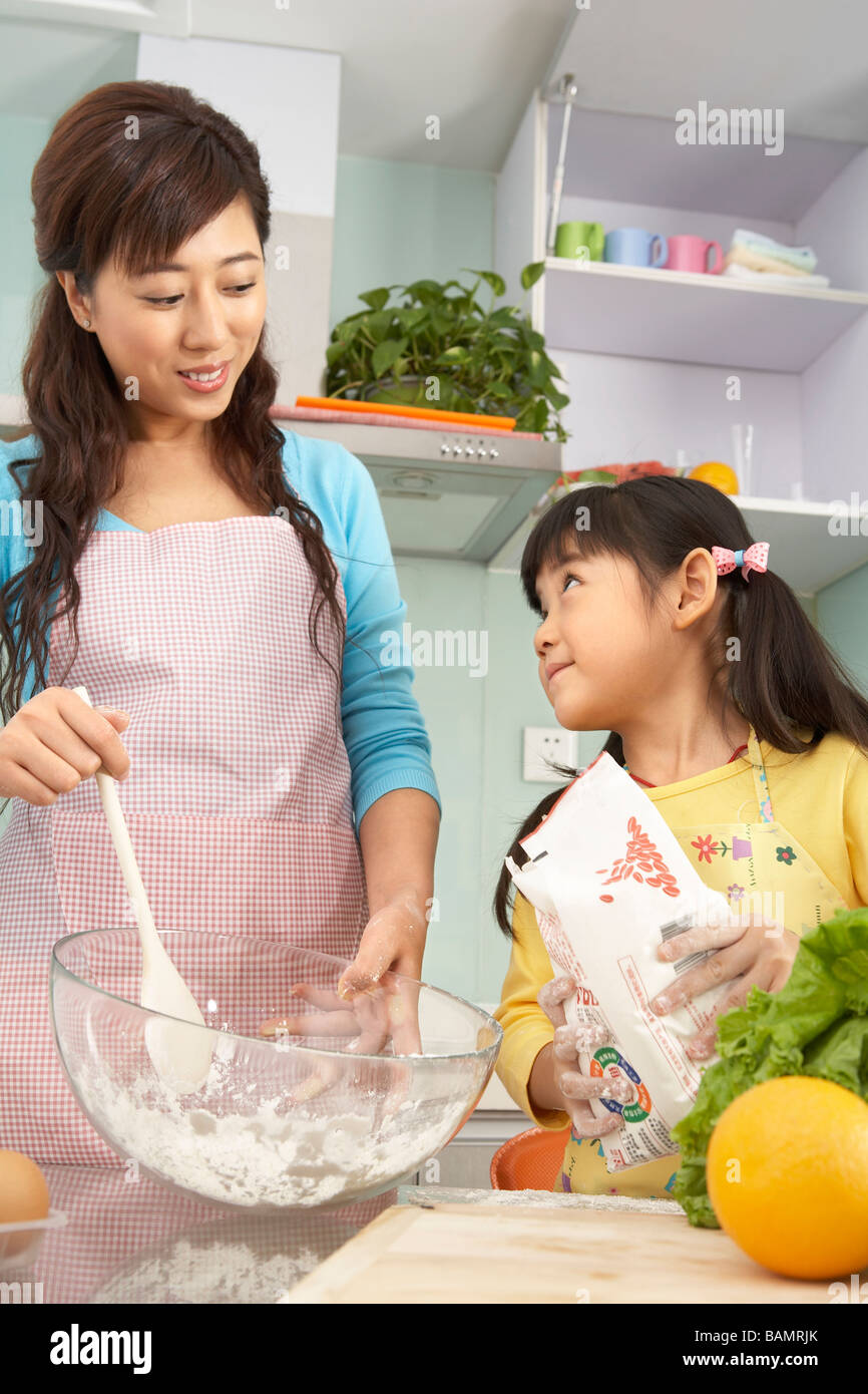 Mother And Daughter Cooking Together Stock Photo - Alamy