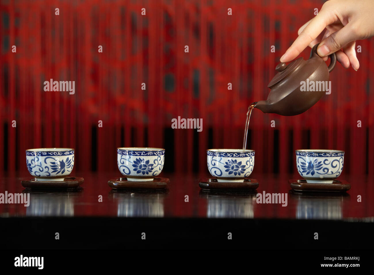 Tea pouring teacups hi-res stock photography and images - Alamy