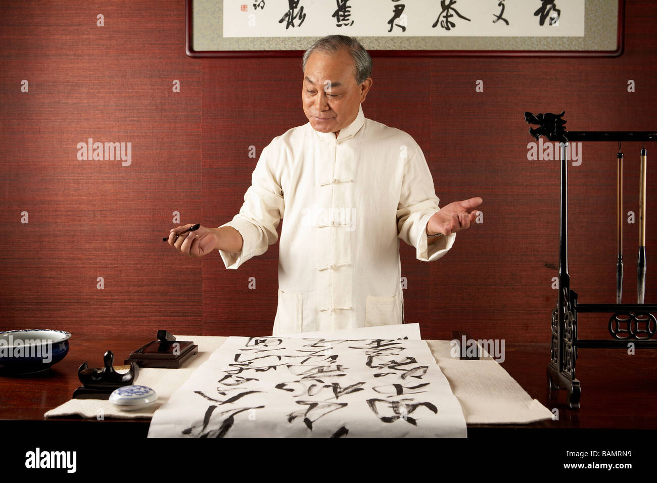 Elderly man practicing calligraphy hi-res stock photography and images ...