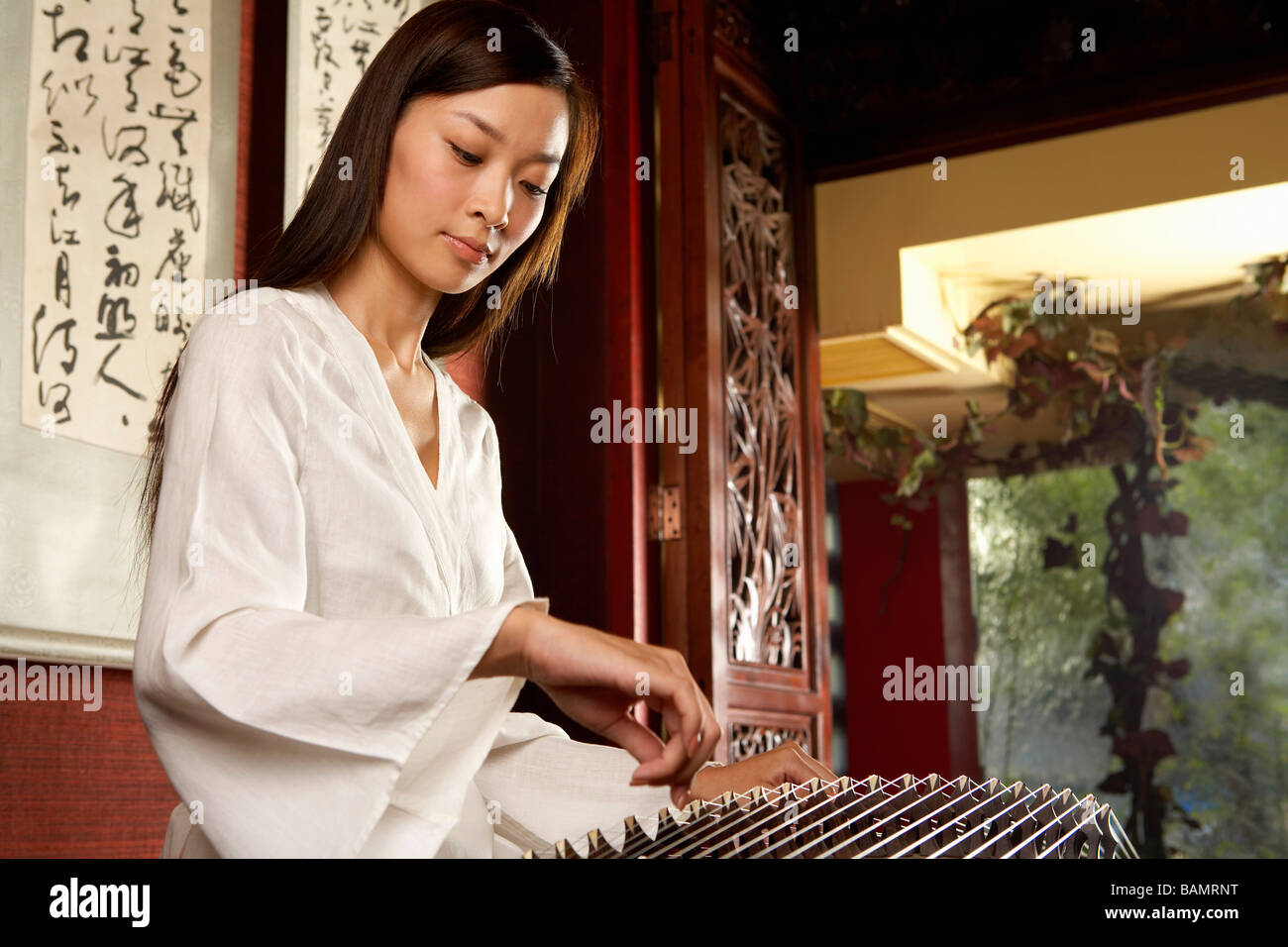 Chinese woman playing stringed musical hi-res stock photography and ...