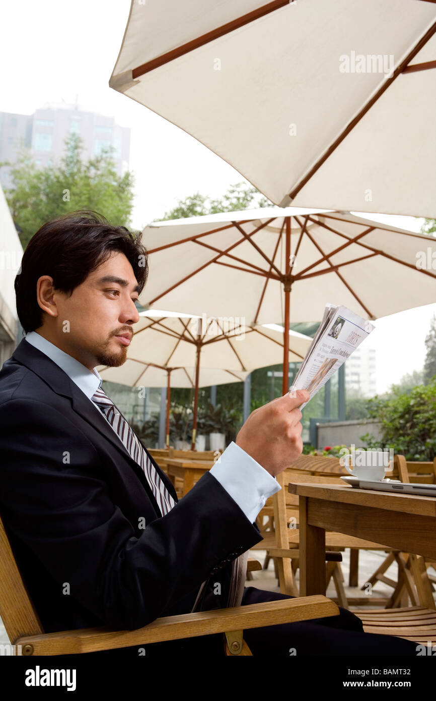 Businessman Reading Newspaper Stock Photo - Alamy Businessman Reading Newspaper Stock Photo - Alamy
