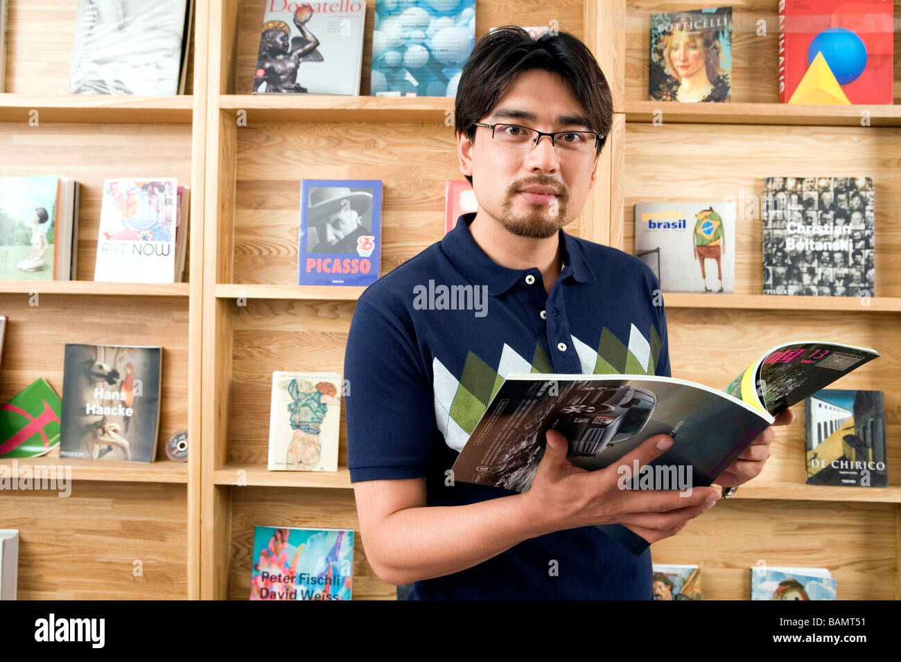 Man Reading Book At Library Stock Photo - Alamy