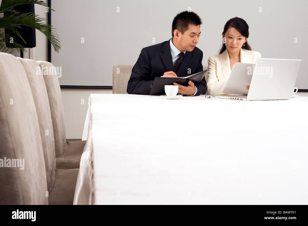 Businesspeople During Working Lunch Stock Photo - Alamy