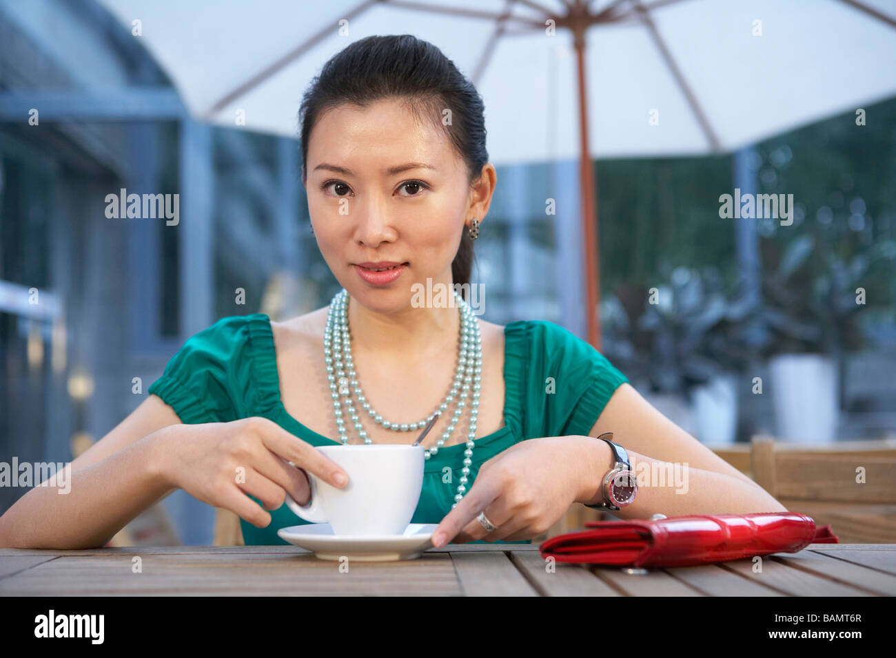 Asian woman sipping tea in hi-res stock photography and images - Alamy