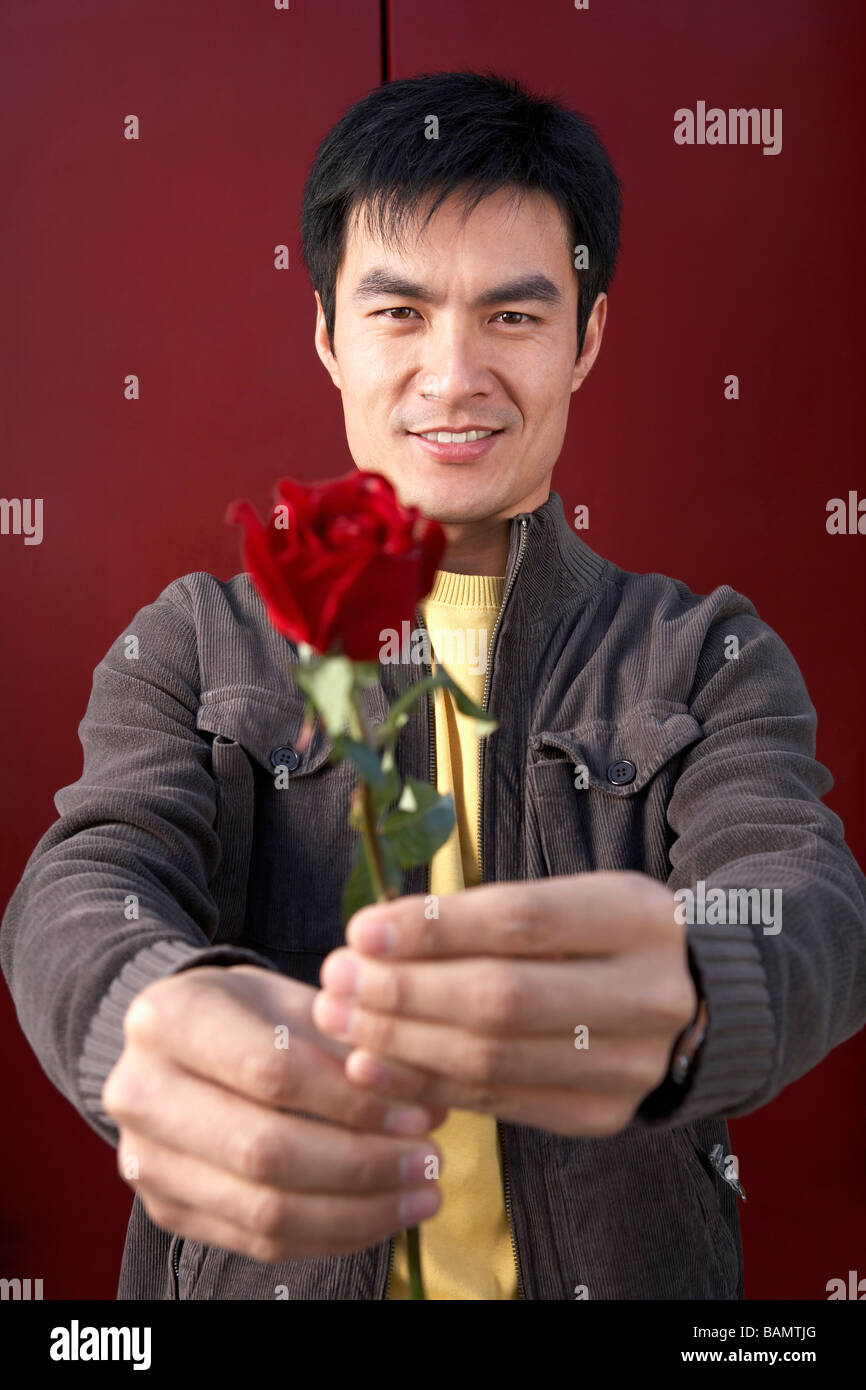Man offering red roses hi-res stock photography and images - Alamy