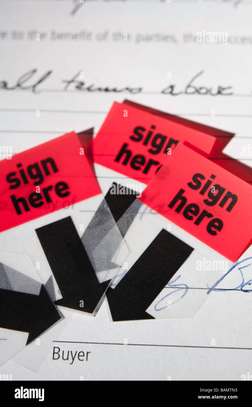 "sign here" stickers pointing to blank spot marked "Buyer Stock Photo ...
