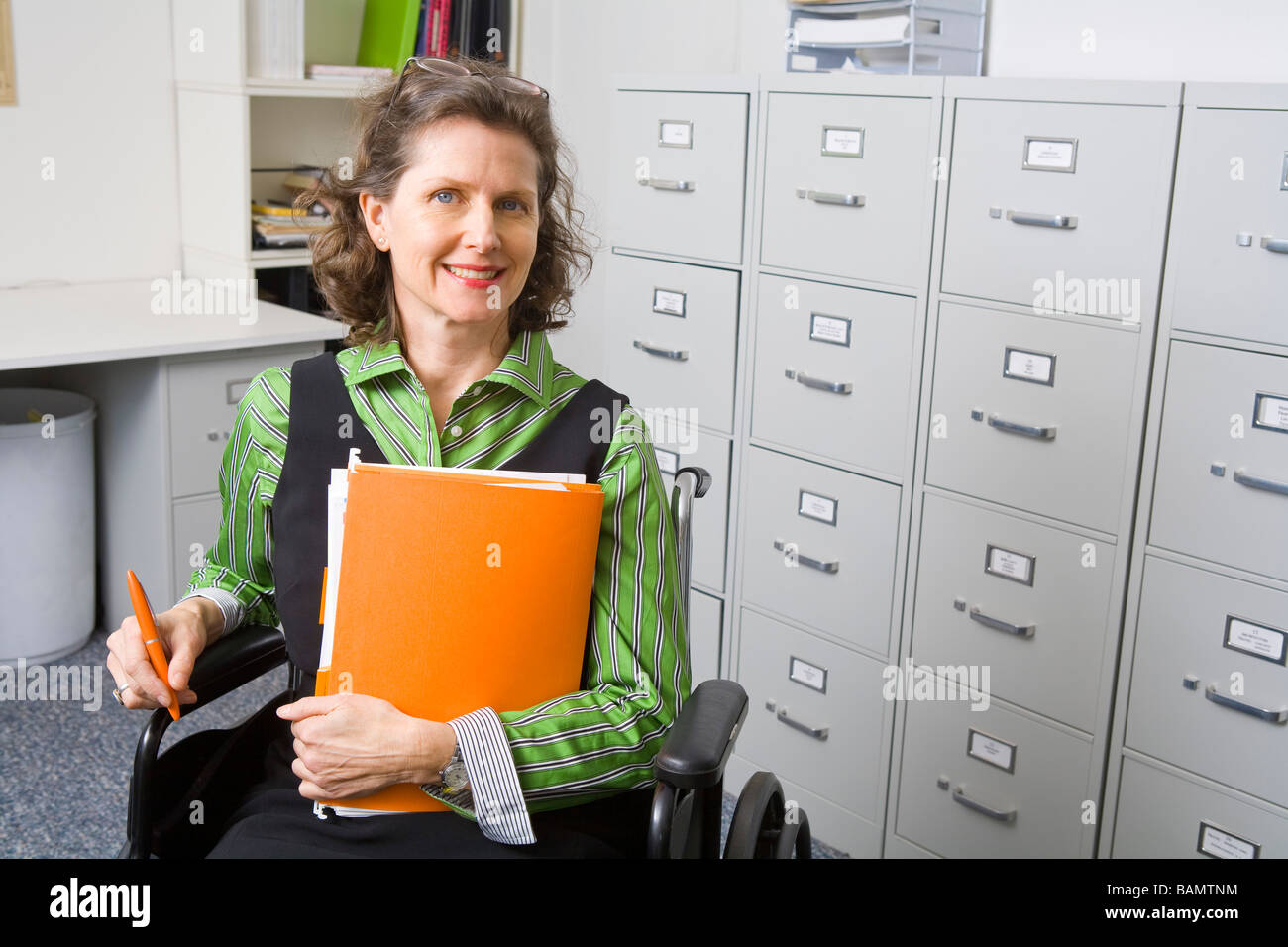 Female secretary wheelchair hi-res stock photography and images - Alamy